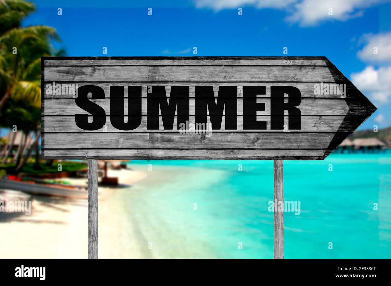 Summer wooden sign with on a beach background Stock Photo - Alamy