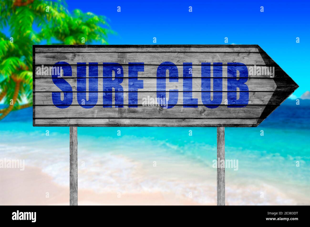 Surf Club wooden sign with on a beach background Stock Photo - Alamy
