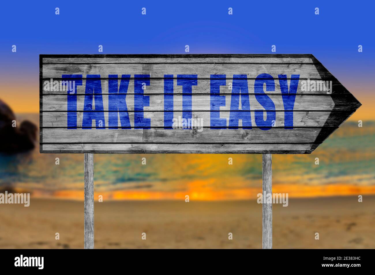 Take It Easy wooden sign with on a beach background Stock Photo - Alamy