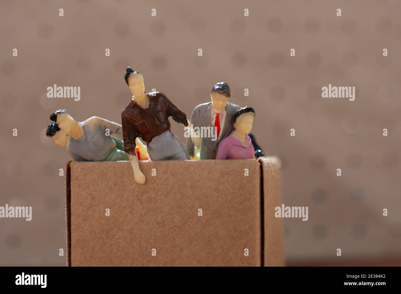 Tiny figurine of men and women miniature model in view Stock Photo - Alamy