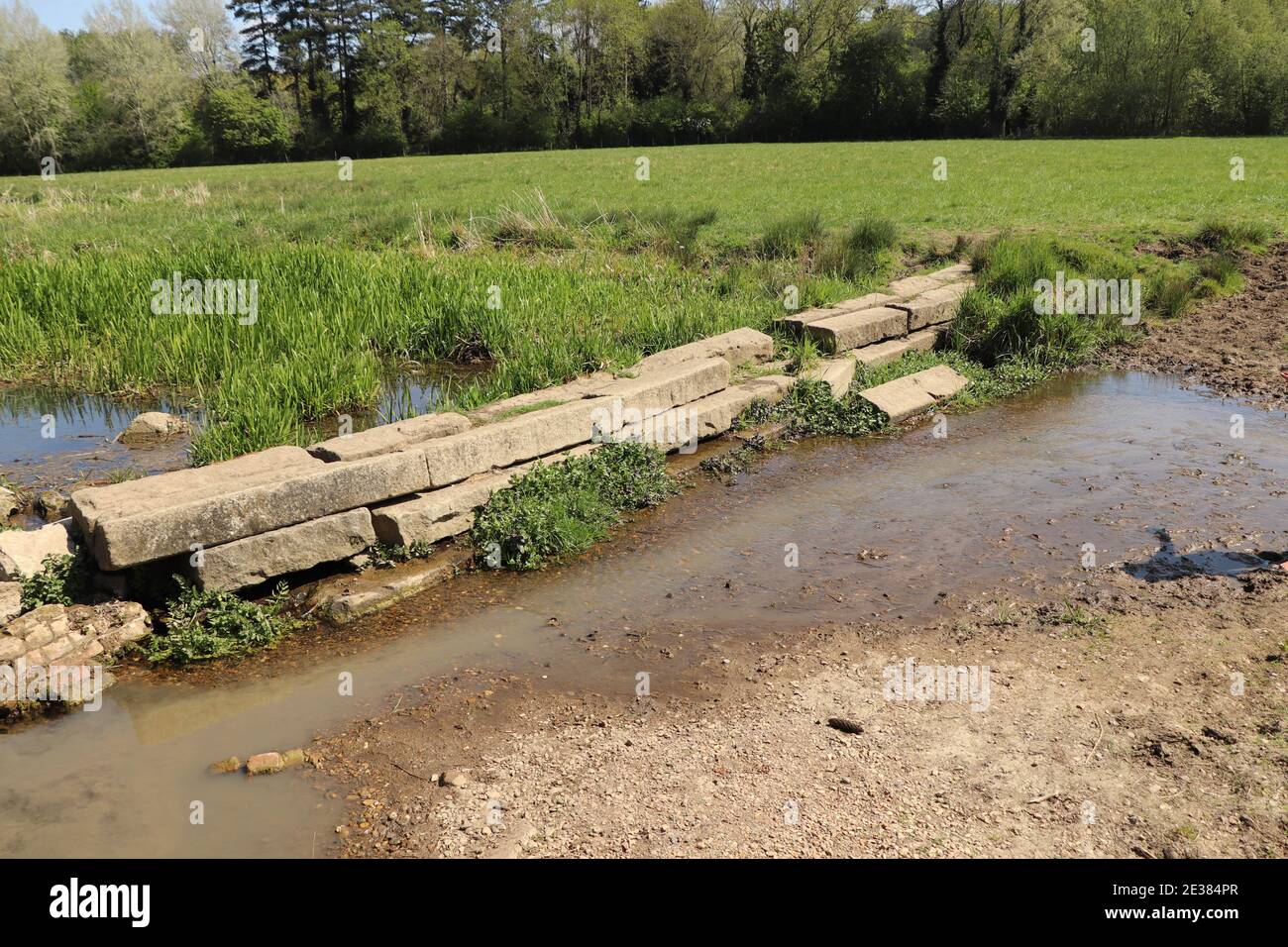 Ground level close up of mud and water sloshing down a stream Stock ...