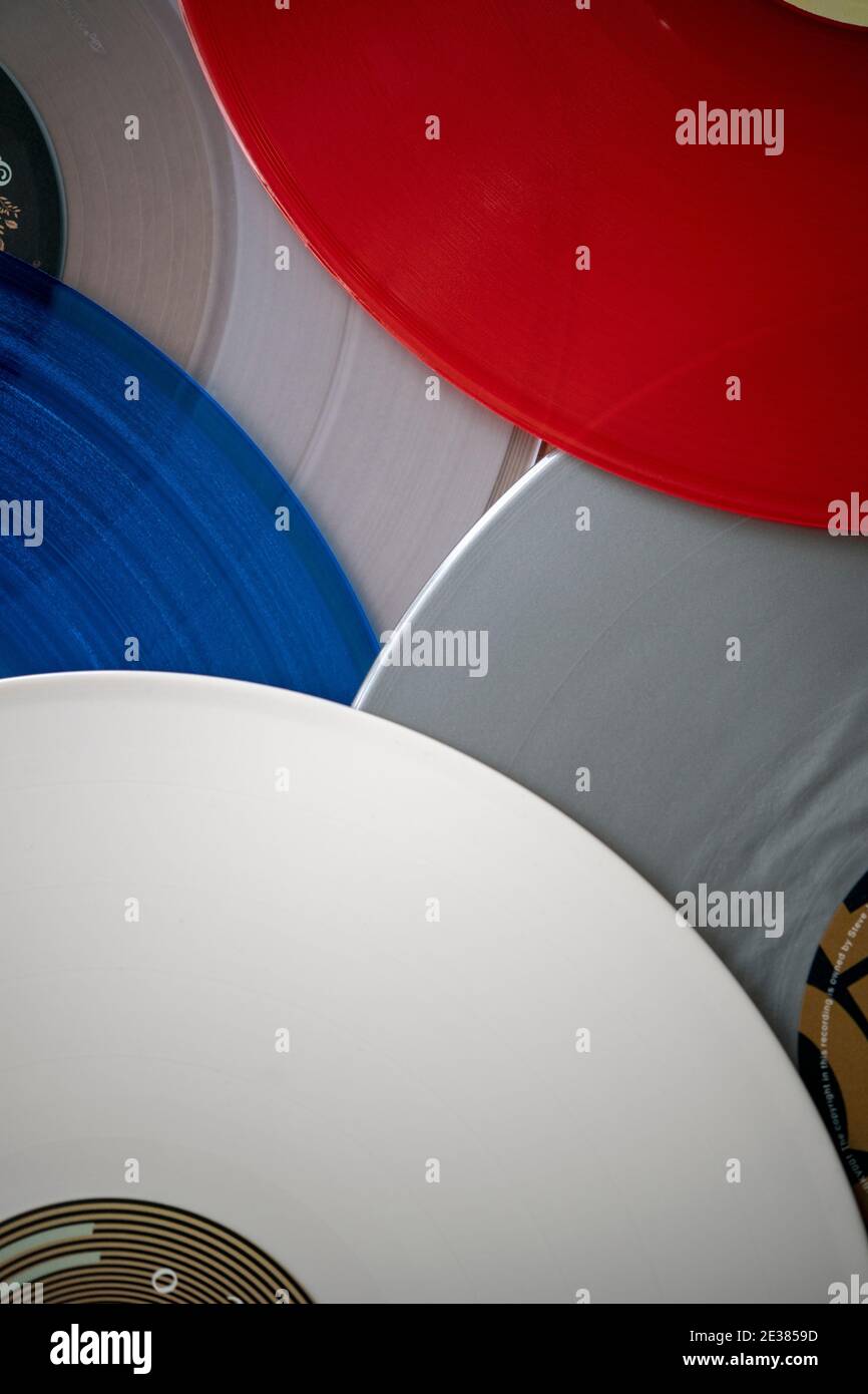 A collection of different coloured vinyl records Stock Photo - Alamy