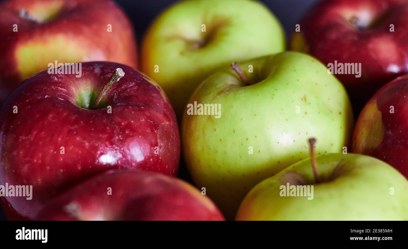 several bright red apples and green apples. close-up of red and green ...