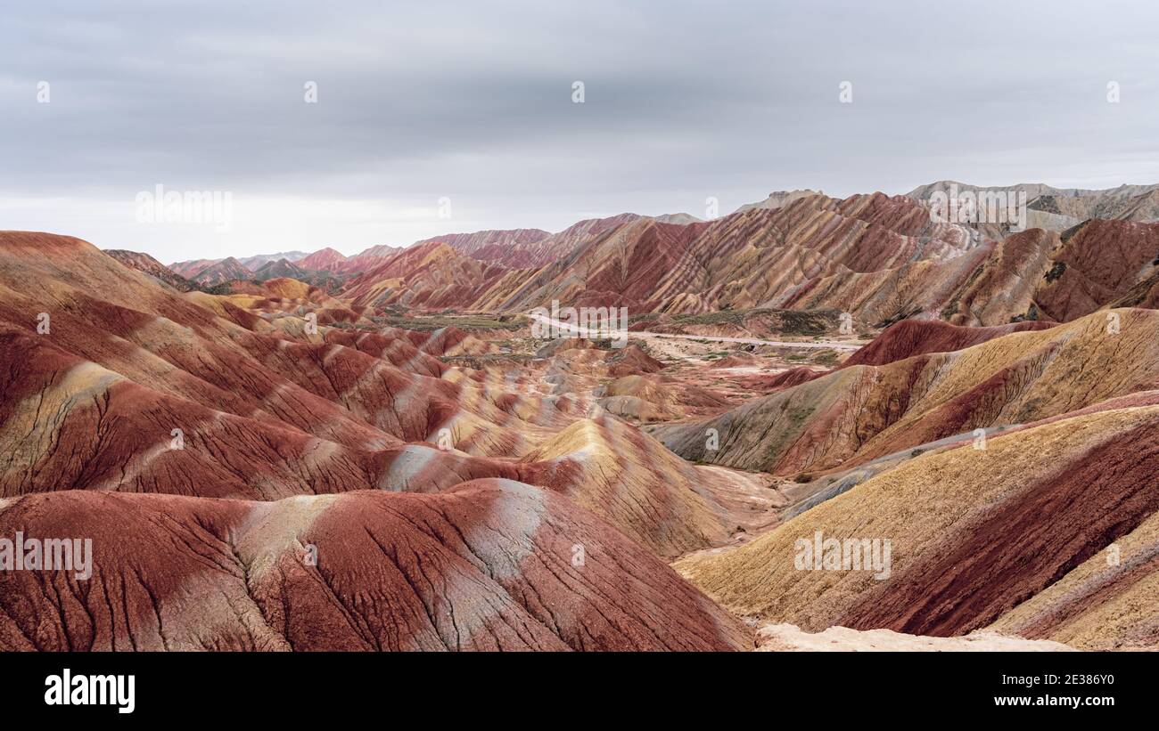 An amazing scenery of colored mountains under a cloudy sky Stock Photo ...