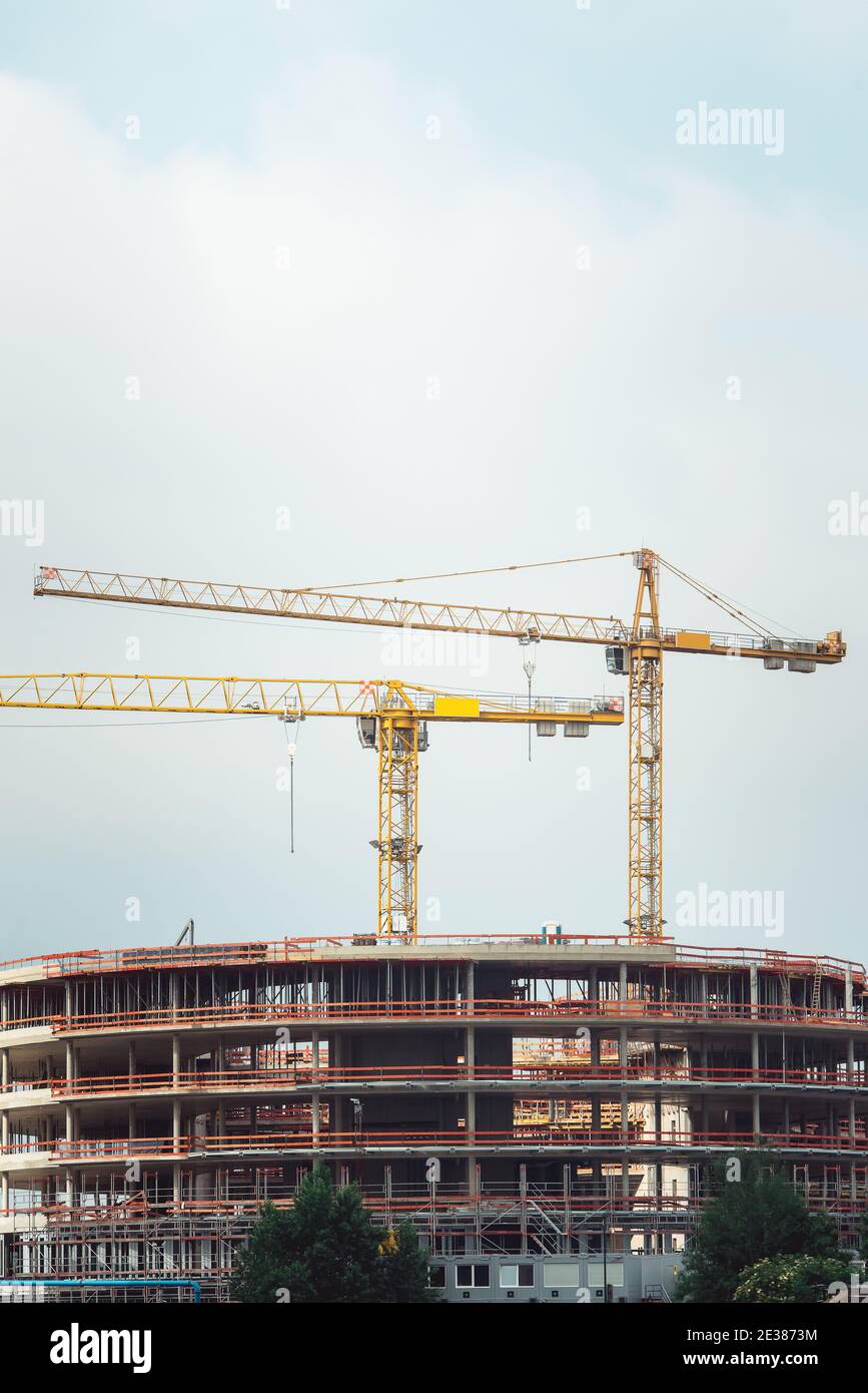 Steel Frames of A Building Under Construction, With Two Tower Cranes On ...