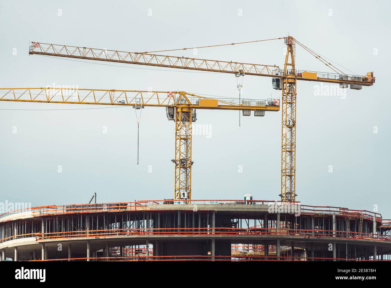 Steel Frames of A Building Under Construction, With Two Tower Cranes On ...