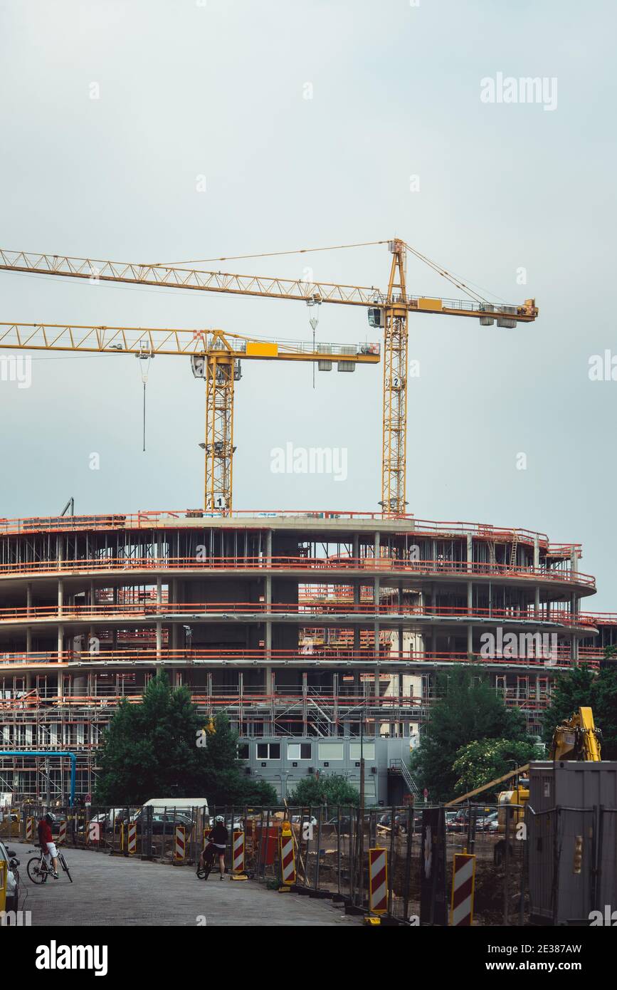 Steel Frames of A Building Under Construction, With Two Tower Cranes On ...