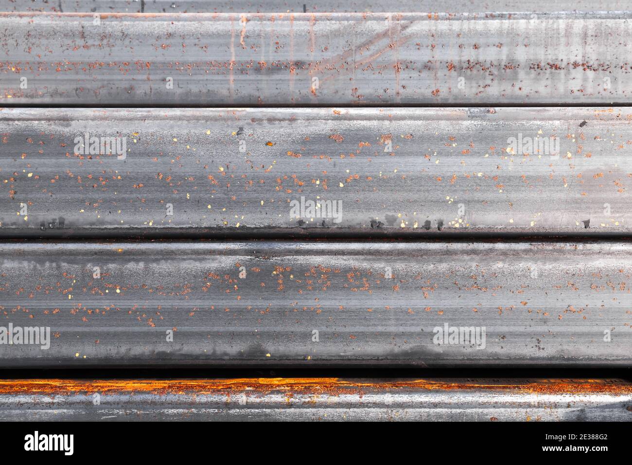 Stack of rolled metal products. Steel pipes of rectangular cross ...