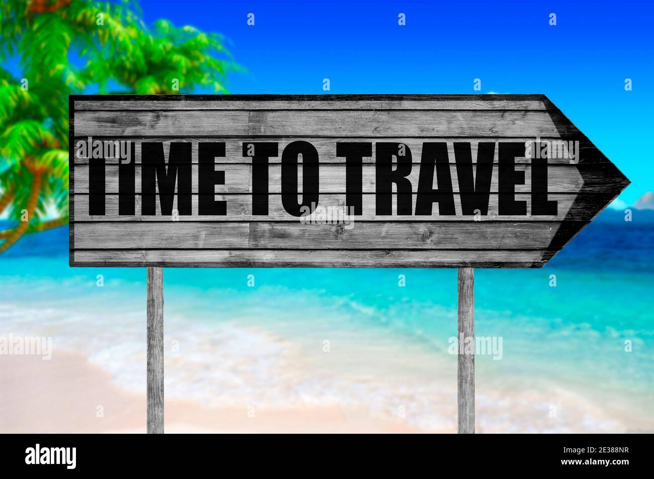 Time to travel on wooden sign with on a beach background Stock Photo ...