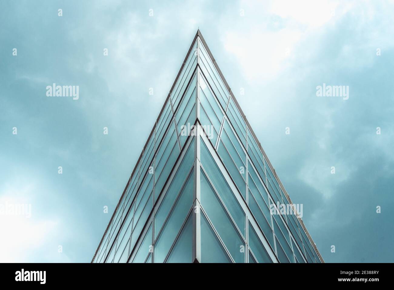 triangle shaped structure against a blue cloudy sky Stock Photo - Alamy