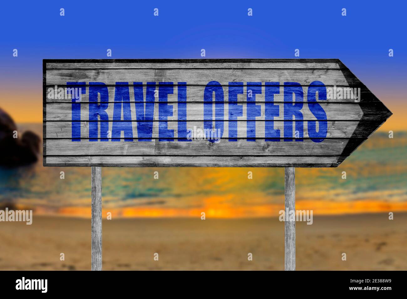 Travel Offers wooden sign with on a beach background Stock Photo - Alamy