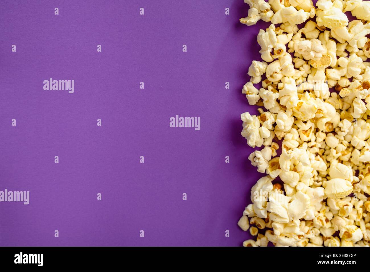 Popcorn border isolated on purple background Stock Photo - Alamy