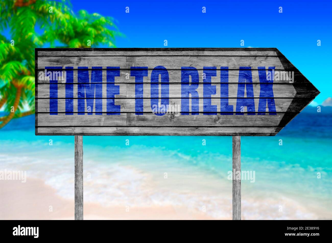 Time To Relax wooden sign with a beach on background Stock Photo - Alamy
