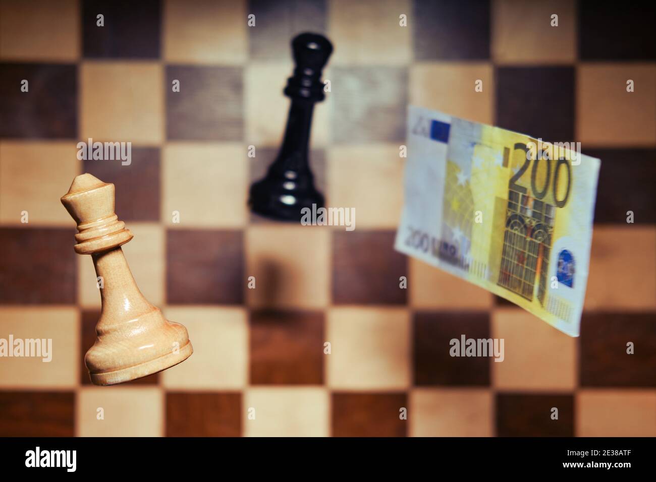 Euro money and a chessboard with chess pieces. Concept of problems of ...