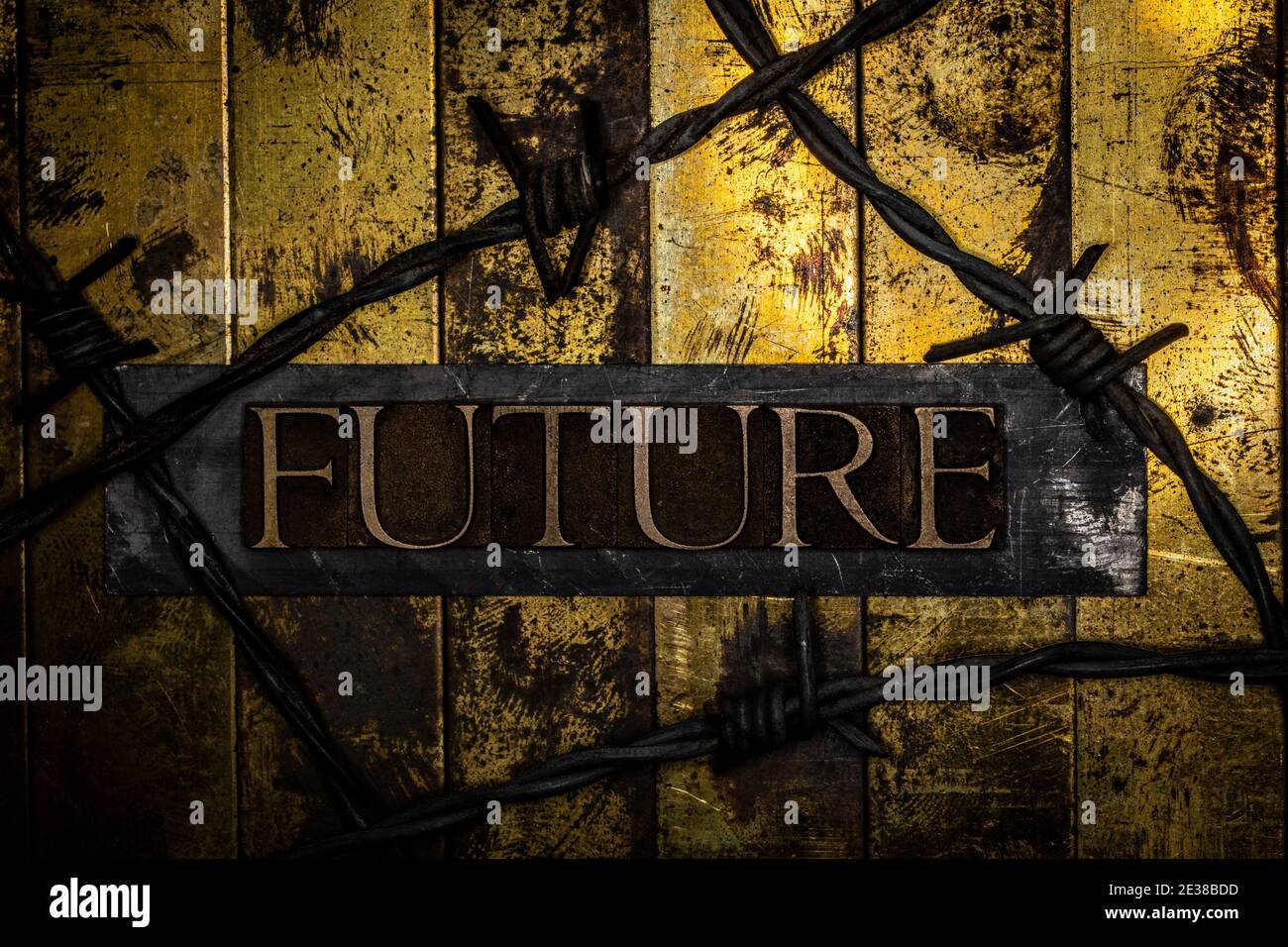 Future text lined with barbed wire on grunge bronze with textured ...