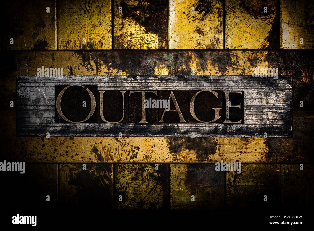 Outage text on vintage grunge textured copper and gold background Stock ...