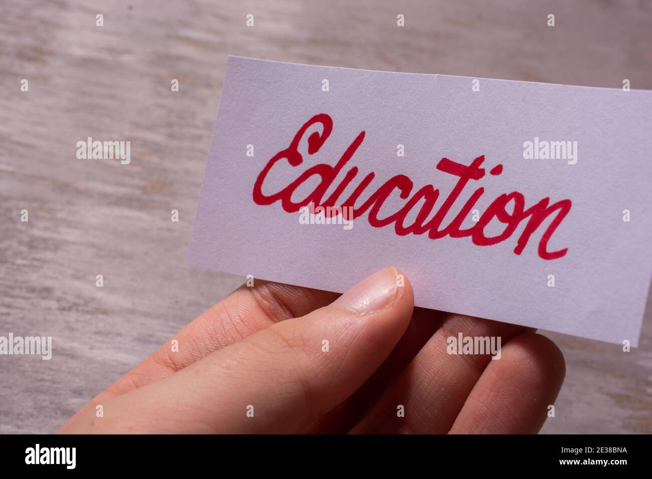 Word education hand written on white paper Stock Photo - Alamy