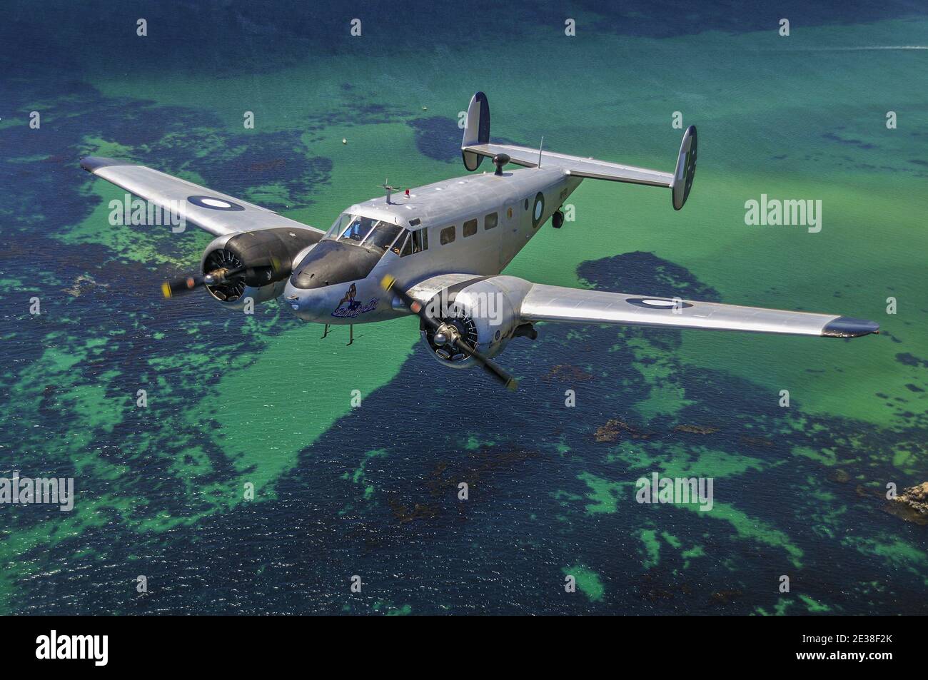 An air-to-air (A2A) portrait of a 1940's Beech 18 Expeditor aircraft in ...