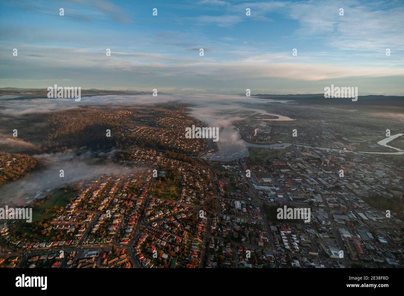 An aerial view of Launceston in Tasmania at dawn. The sun rises over ...