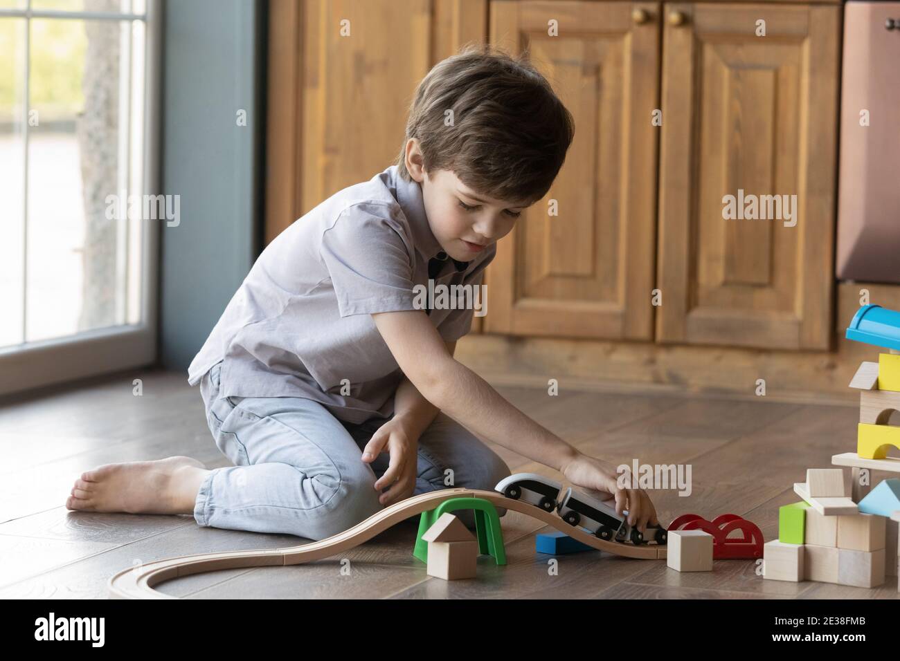 Little boy have fun play toys at home Stock Photo - Alamy