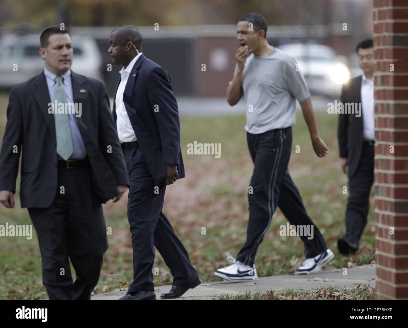 U.S. President Barack Obama (C) leaves after playing basketball at Ft ...
