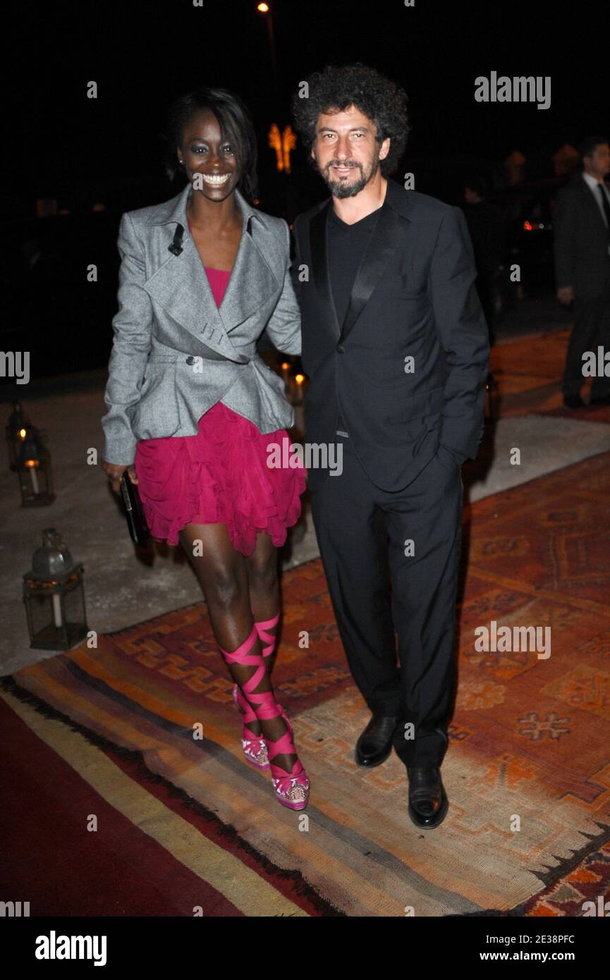 Aissa Maiga and Radu Mihaileanu arriving at Dior party during the 10th ...