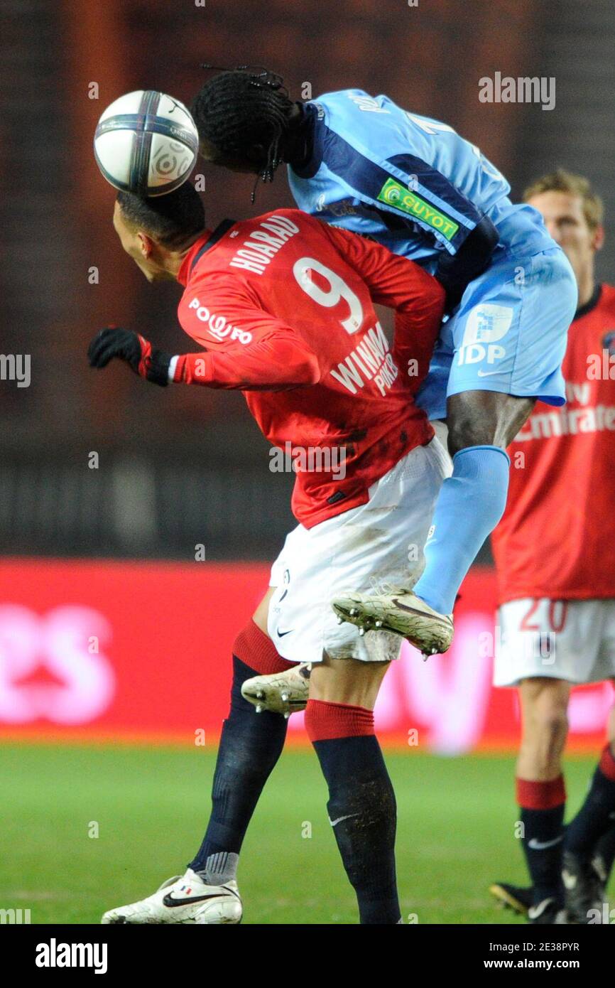 Paris-St-Germain's Guillaume Hoarau battling Brest's Moise Brou Apanga ...