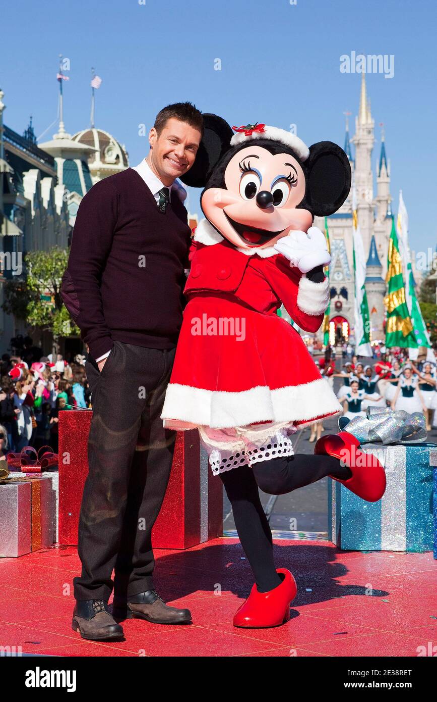 Ryan Seacrest poses with Minnie Mouse while taping the 'Disney Parks ...