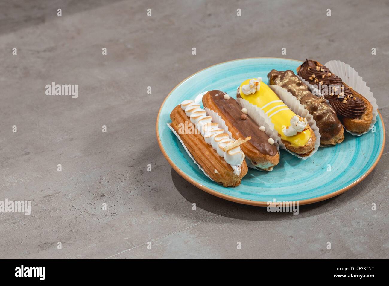 Eclairs with different ganache and icing with different toppings Stock ...