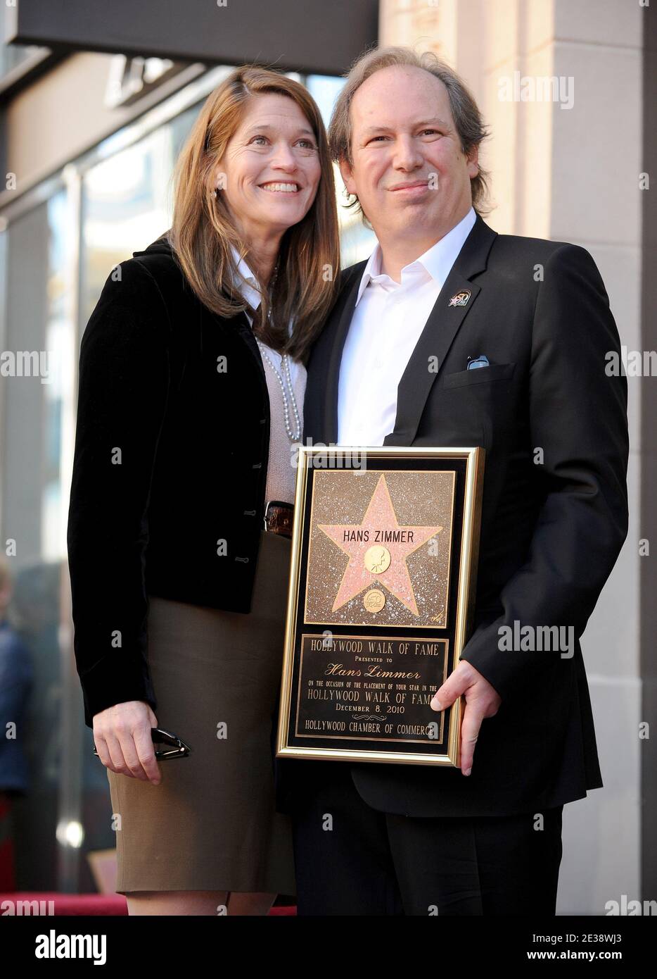 Composer Hans Zimmer, posing with his wife Suzanne, is honored with a ...