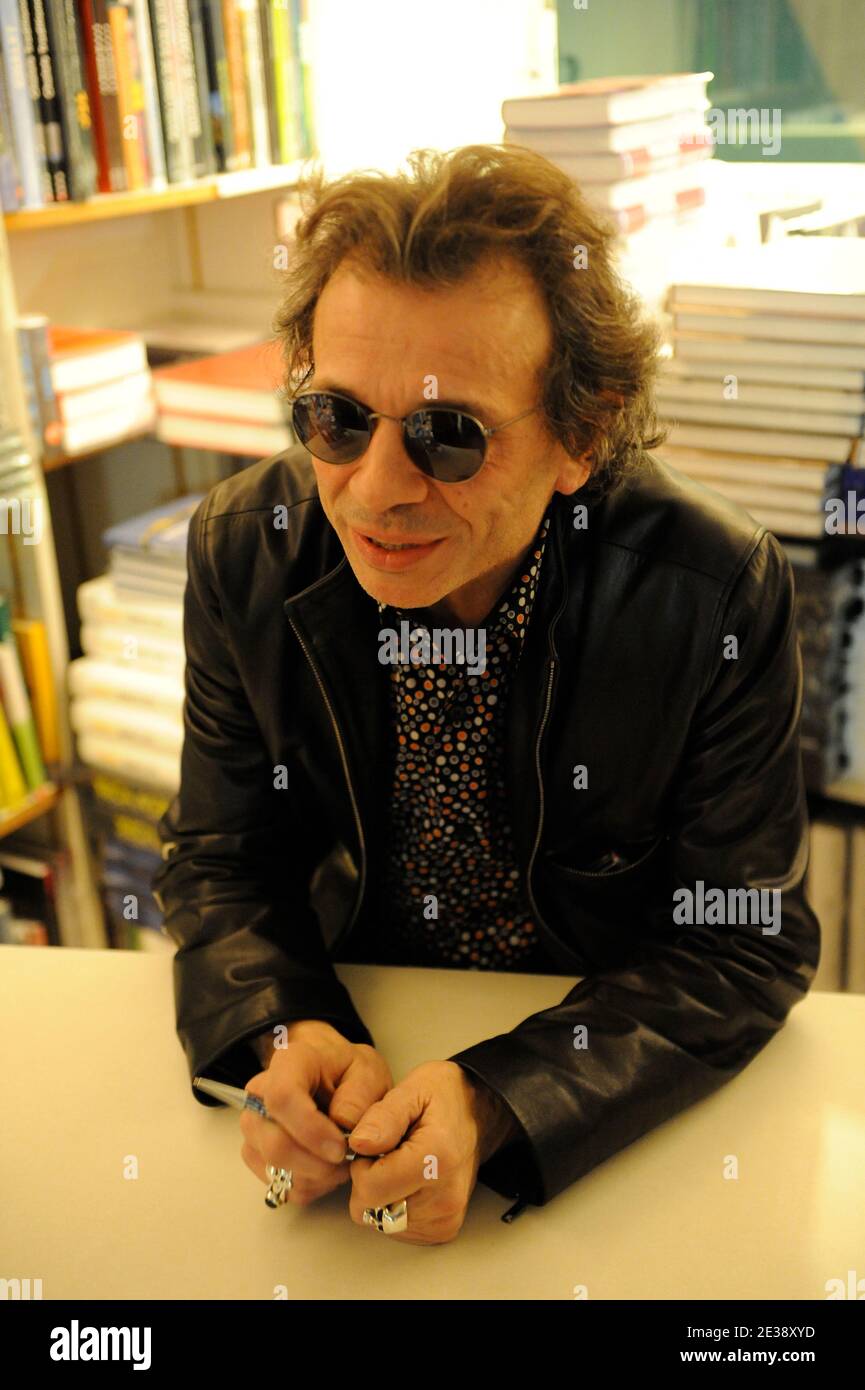Philippe Manoeuvre signs autograph on his book "Rock Francais" at La ...
