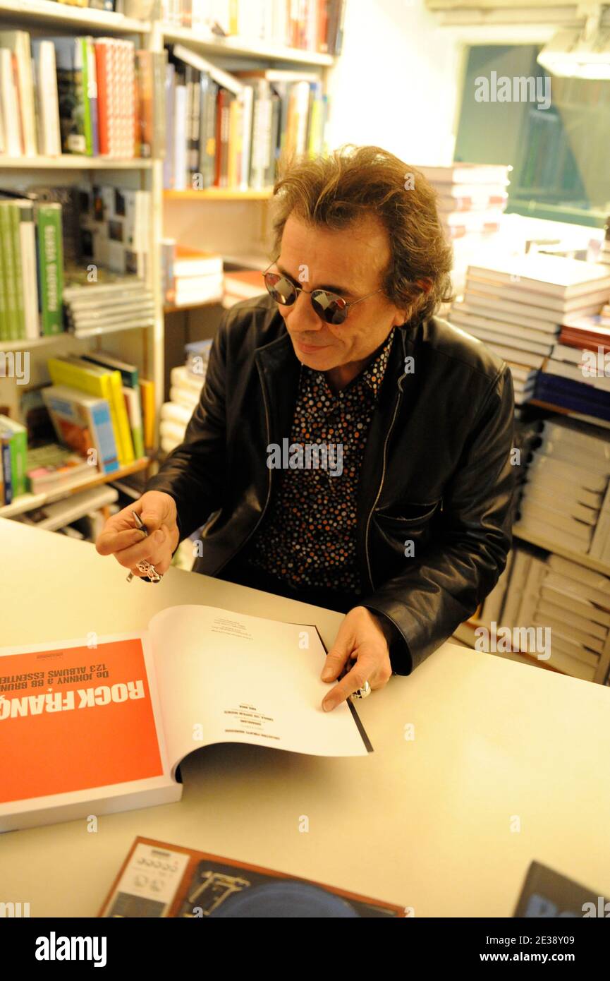 Philippe Manoeuvre signs autograph on his book "Rock Francais" at La ...