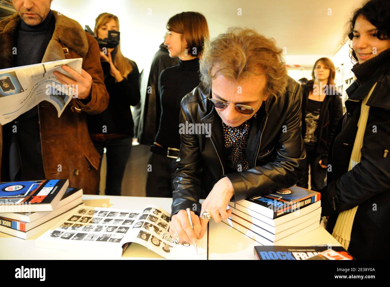 Philippe Manoeuvre signs autograph on his book "Rock Francais" at La ...