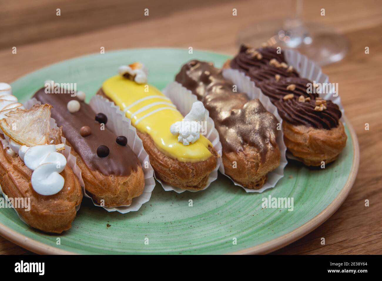 Eclairs with different ganache and icing with different toppings Stock ...