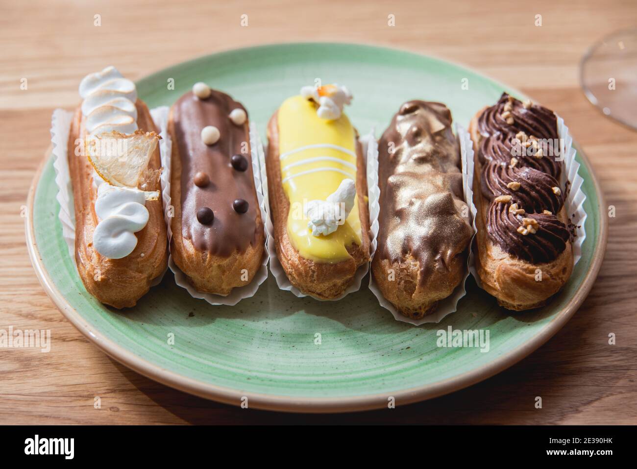 Eclairs with different ganache and icing with different toppings Stock ...