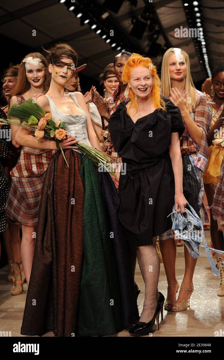 Designer Vivienne Westwood flanked by model appears during her spring ...