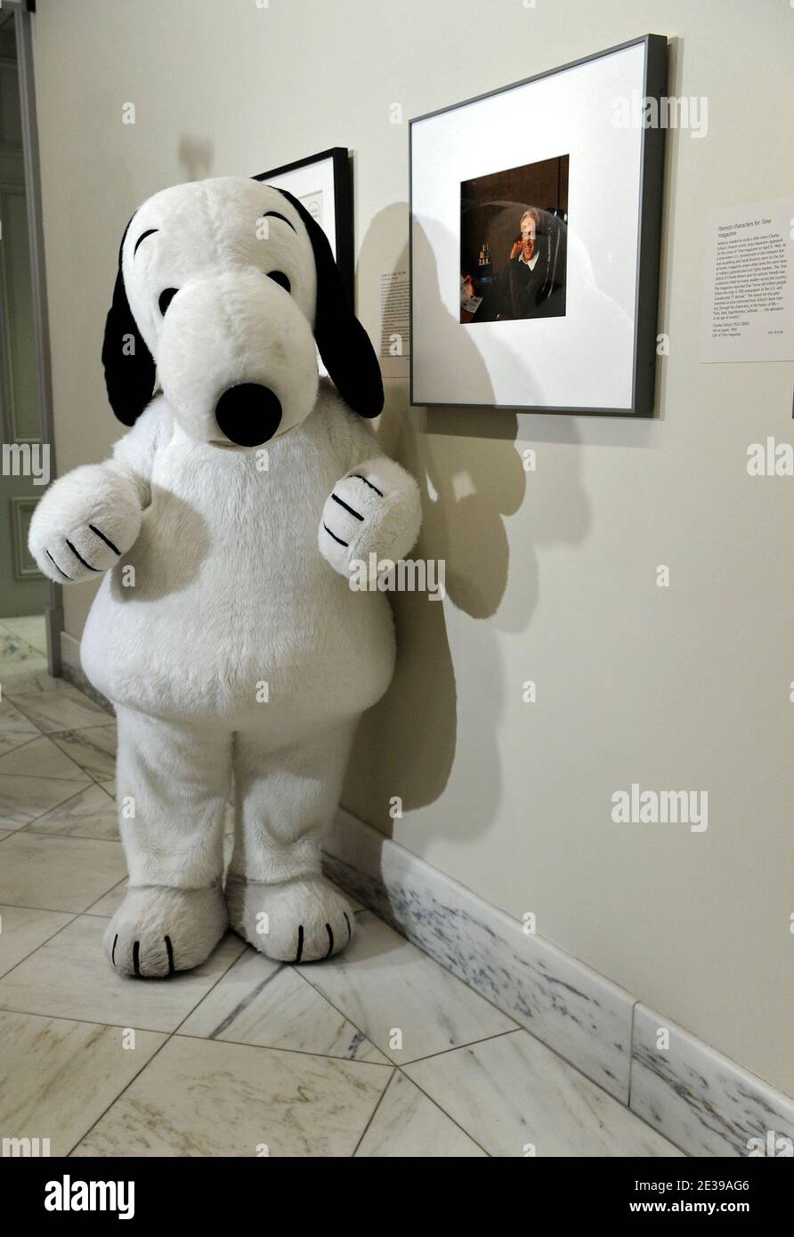 Snoopy poses with Charles M. Schulz portrait display during the 60th ...