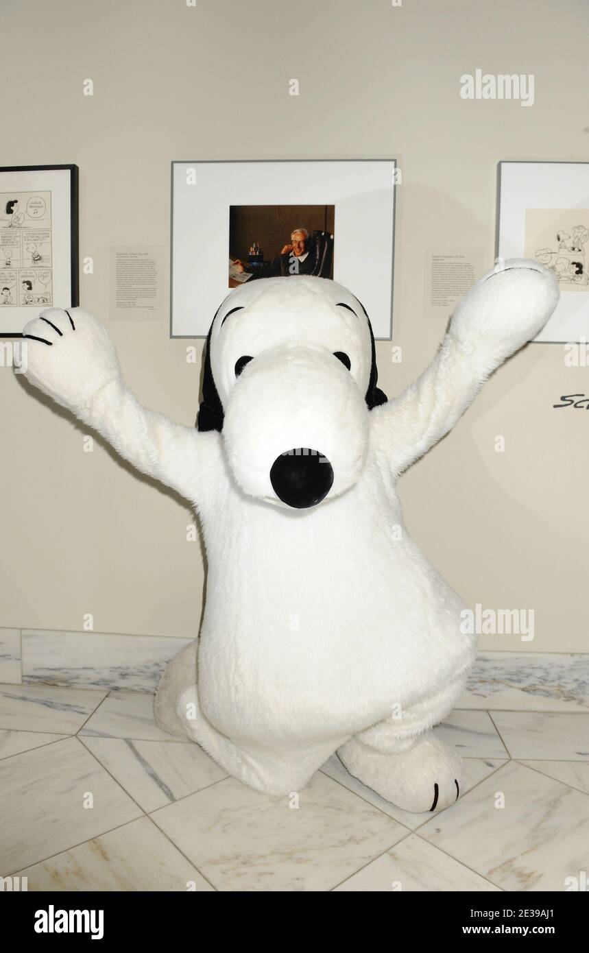 Snoopy poses with Charles M. Schulz portrait display during the 60th ...