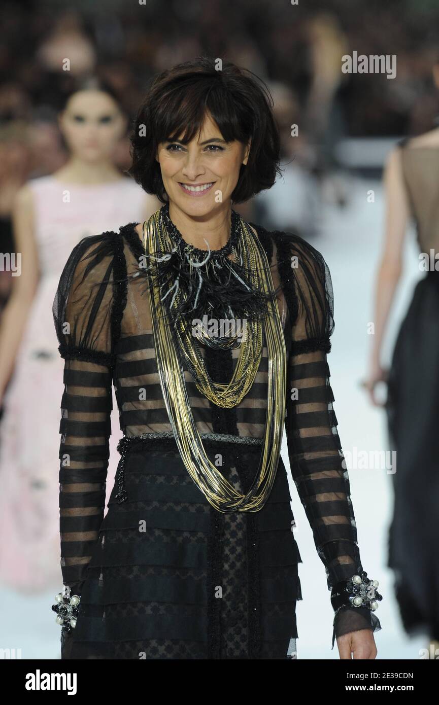 Ines de La Fressange displays a creation by Karl Lagerfeld for Chanel ...