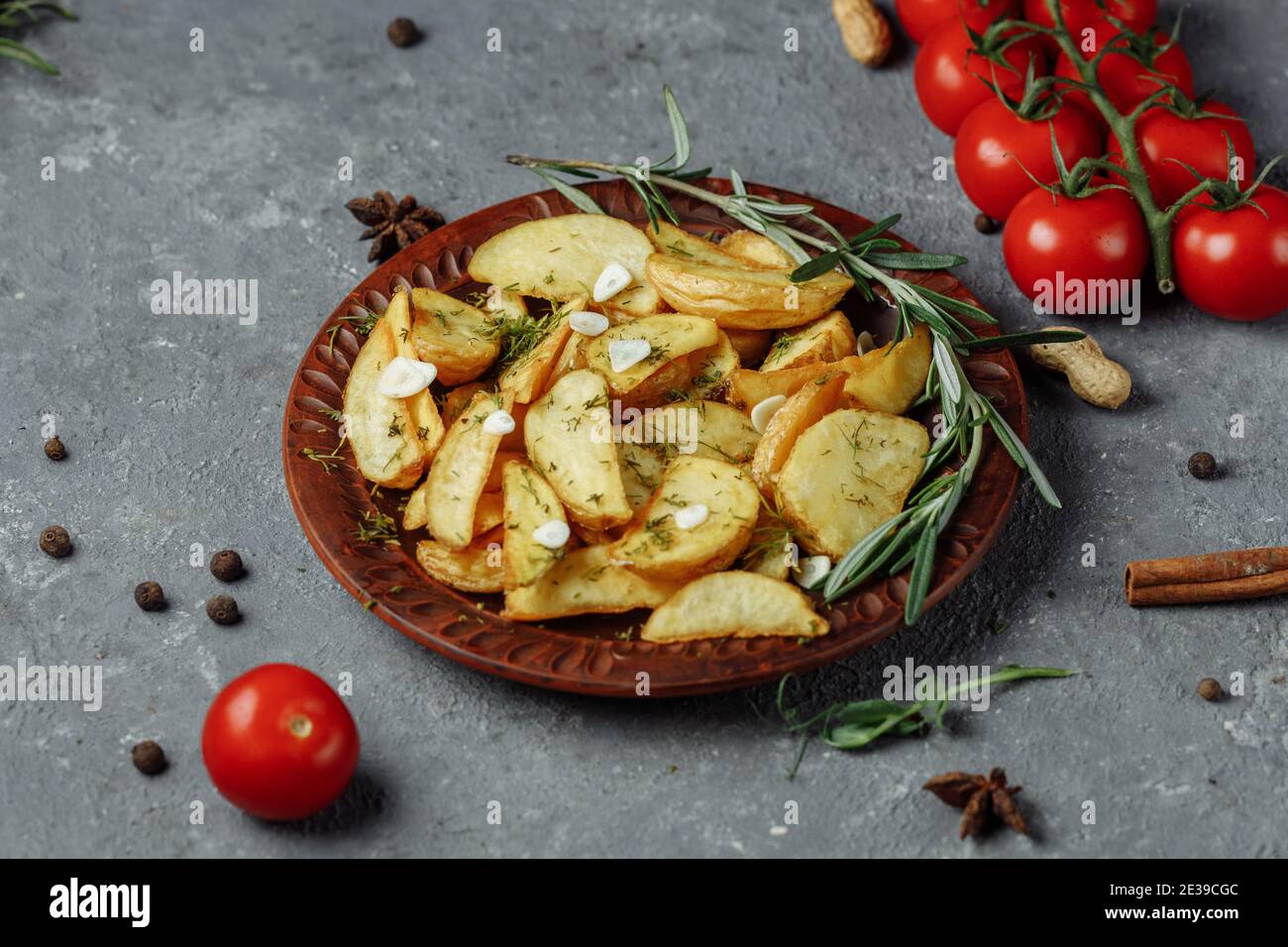 roasted rosemary garlic potato wedges on a plate Stock Photo - Alamy
