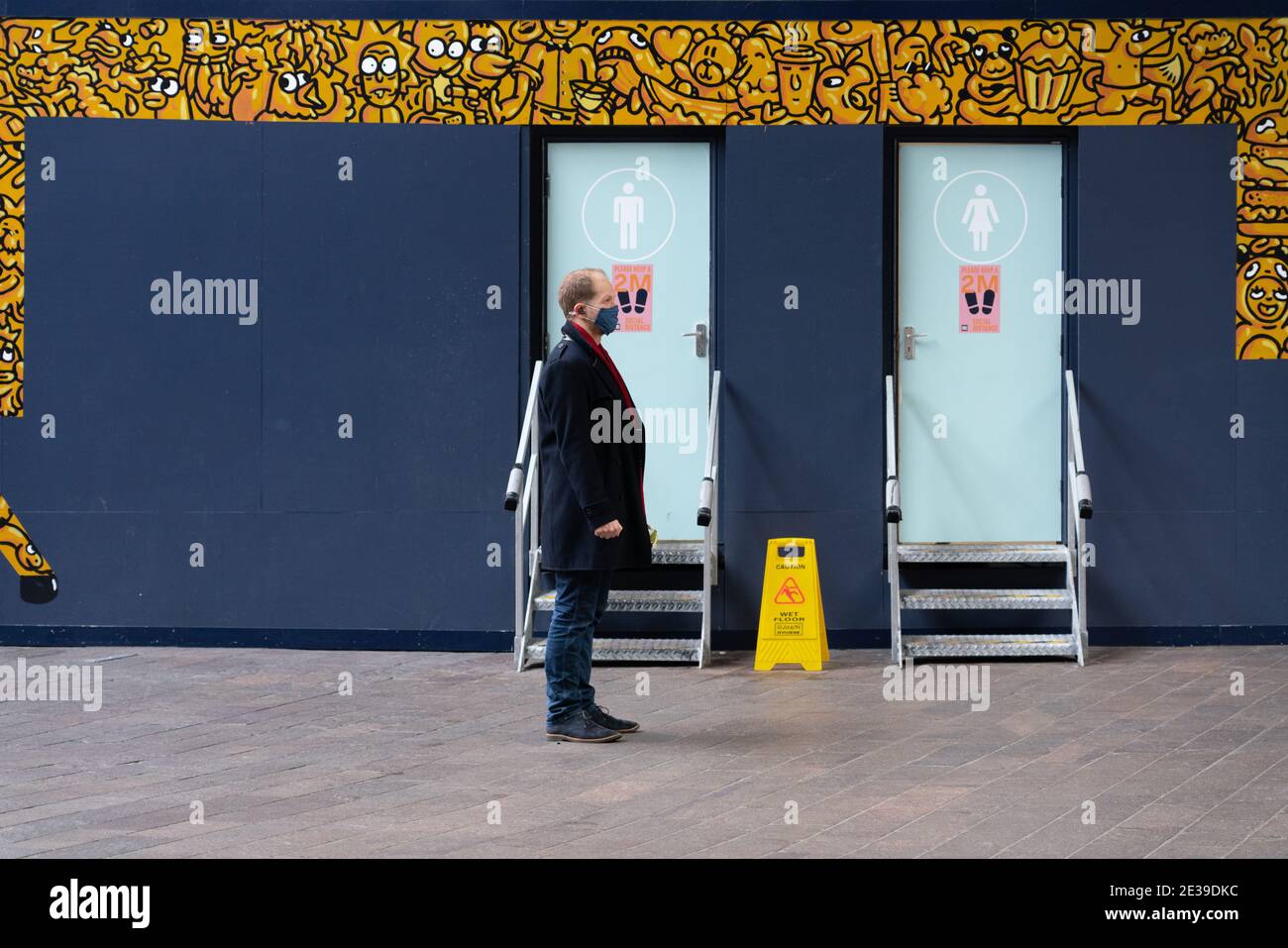man queuing outside public toilet near Waitrose King's Cross, Granary ...