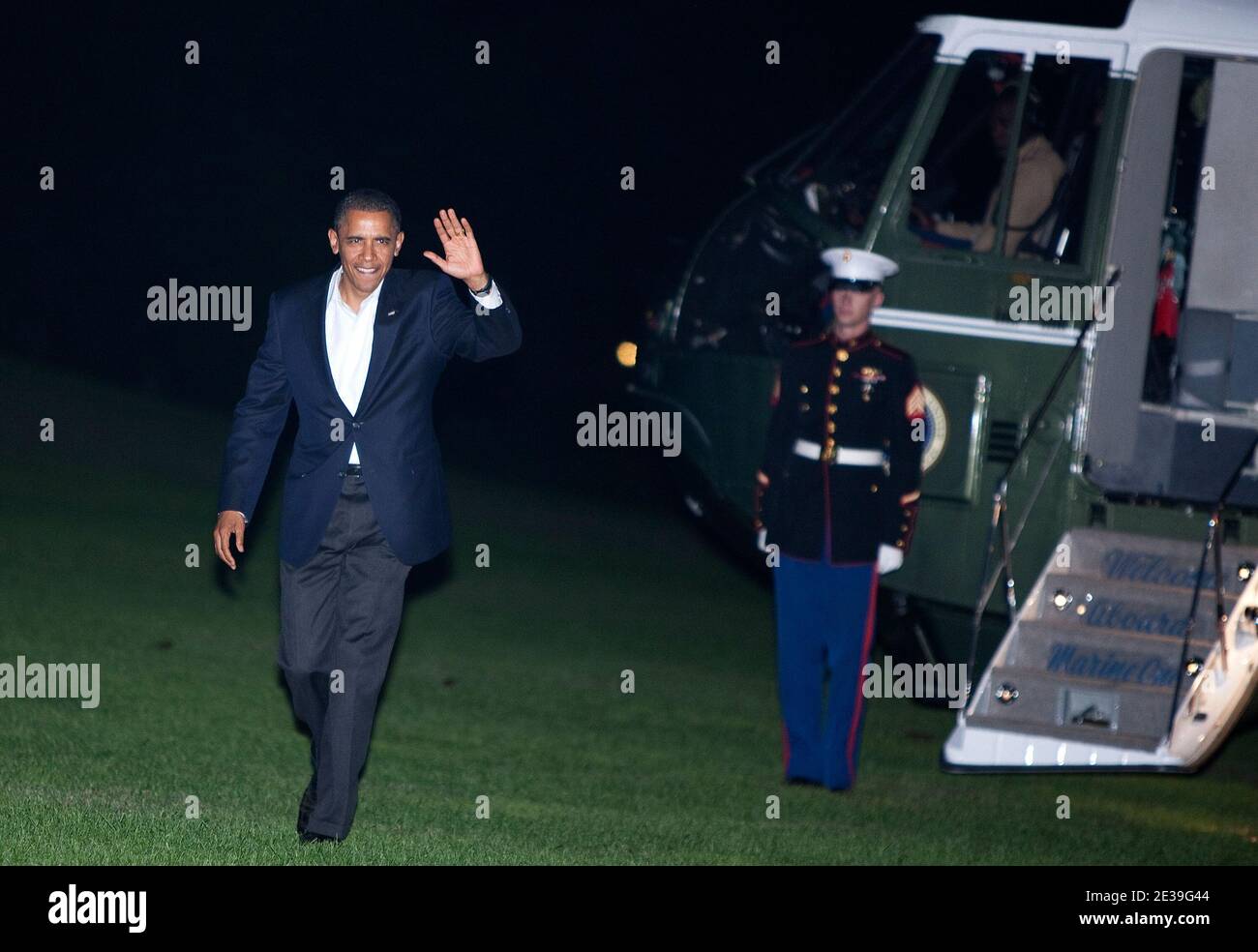 U.S. President Barack Obama waves as he walks from Marine One on the ...
