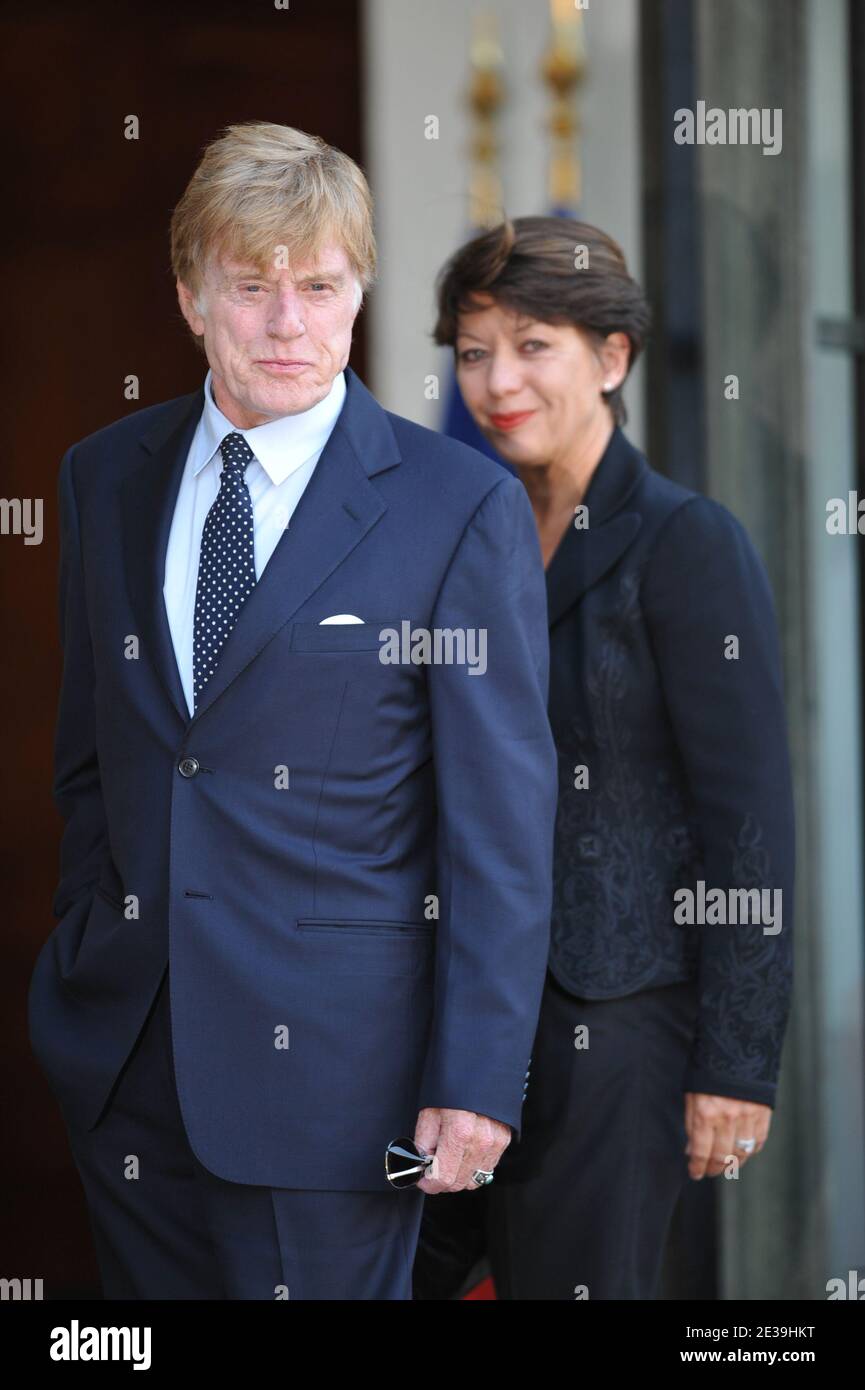 US director and actor Robert Redford flanked by his wife arrives at the ...