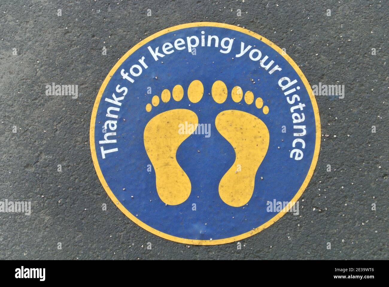 A "Thanks for keeping your distance" sign on a railway platform ...