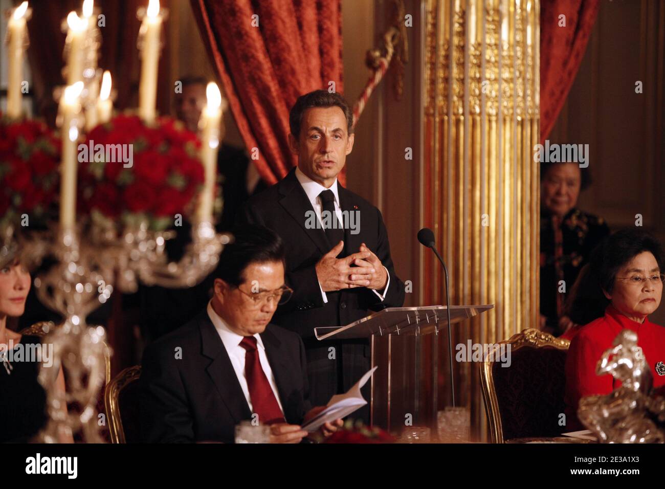 French President Nicolas Sarkozy delivers a speech near his wife Carla ...