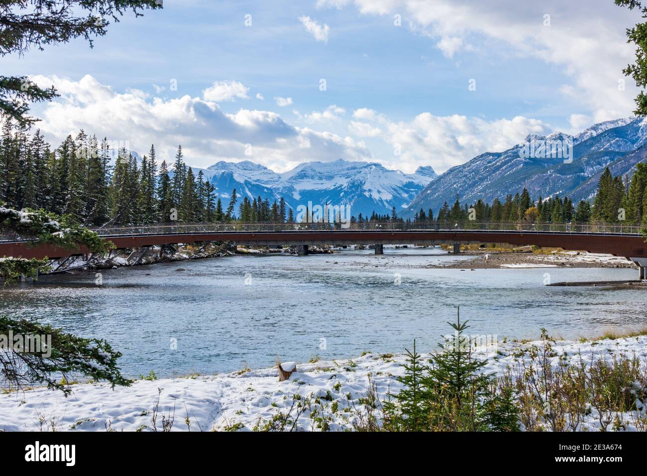 Banff Pedestrian Bridge and Bow River trail in snowy autumn day. Banff National Park, Canadian ...