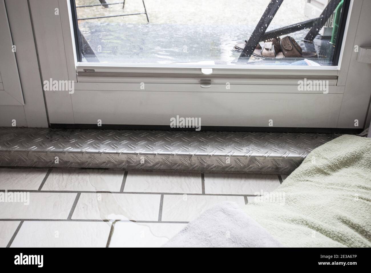 A metal flashing under the doorstep for extra protection Stock Photo ...