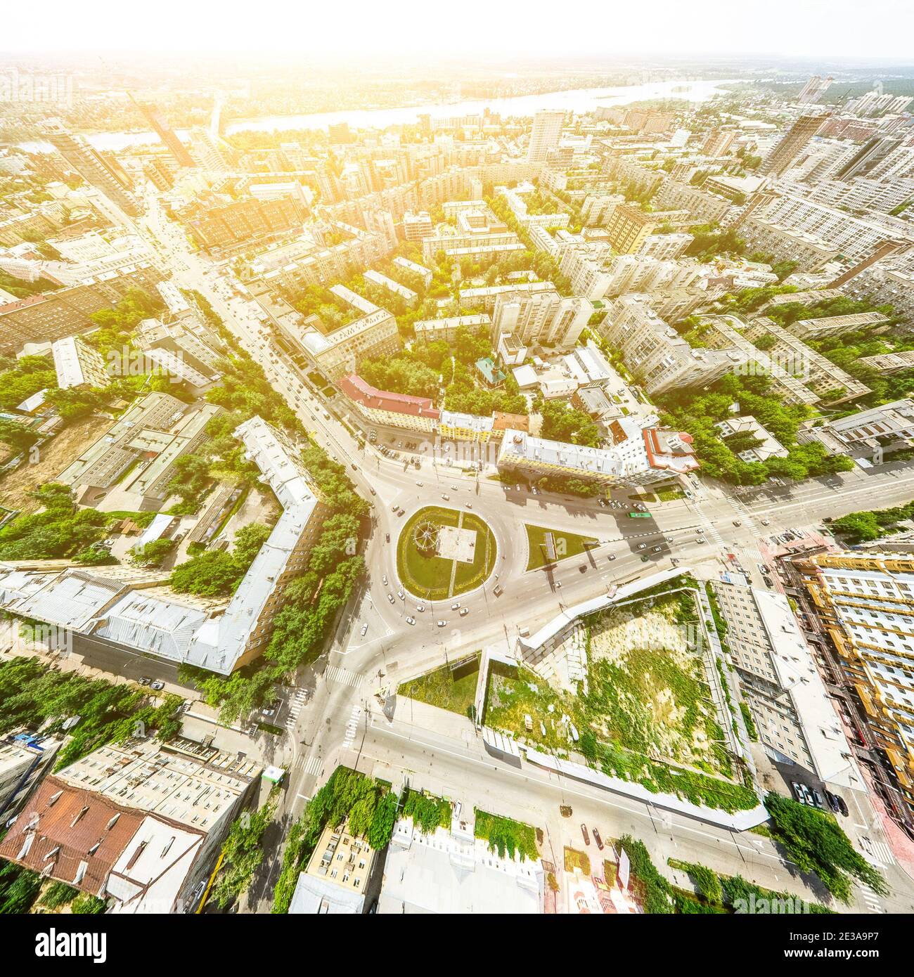 Aerial city view with crossroads and roads, houses, buildings, parks ...