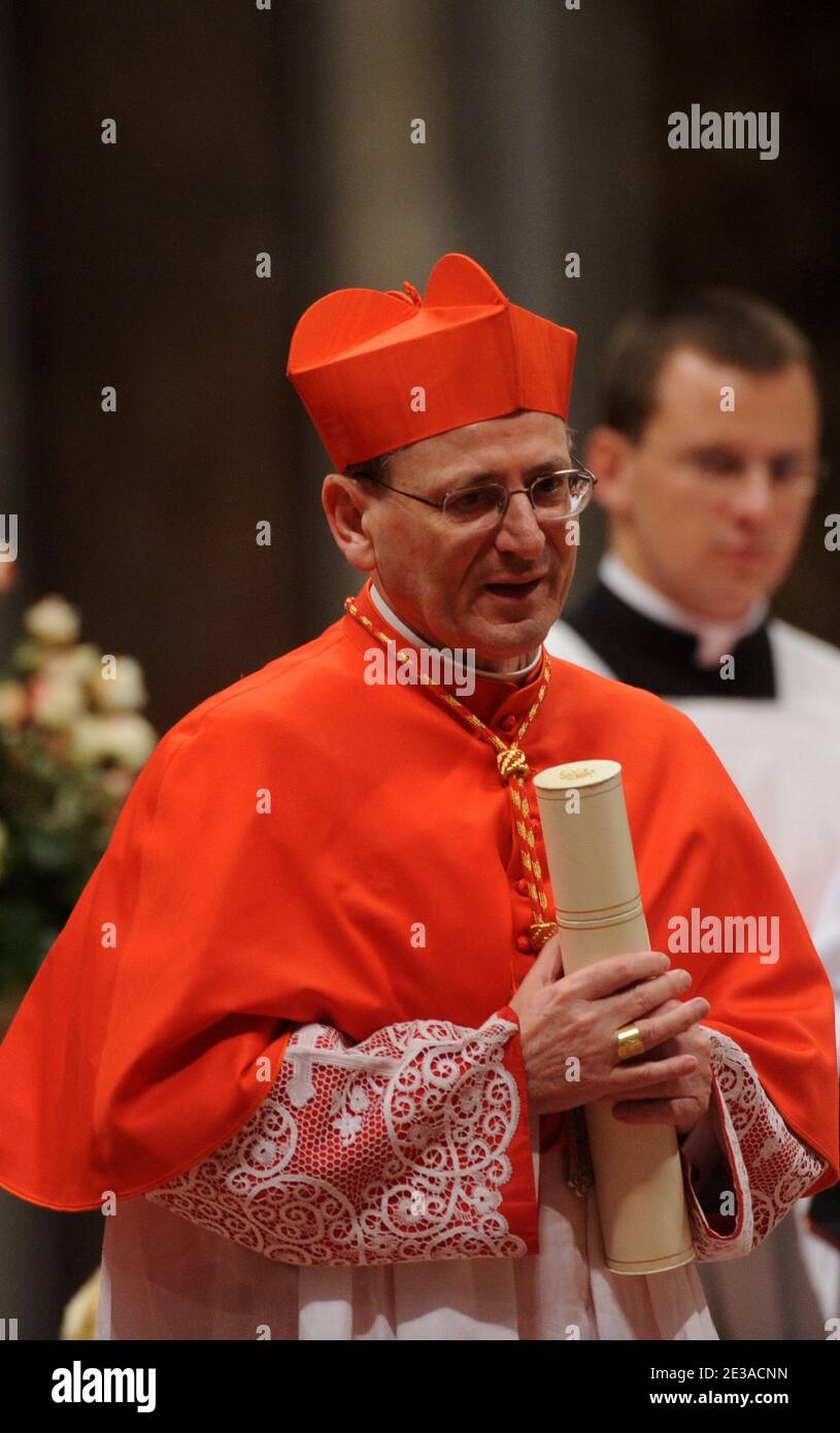 New cardinal Angelo Amato receives the biretta cap from Pope Benedict ...