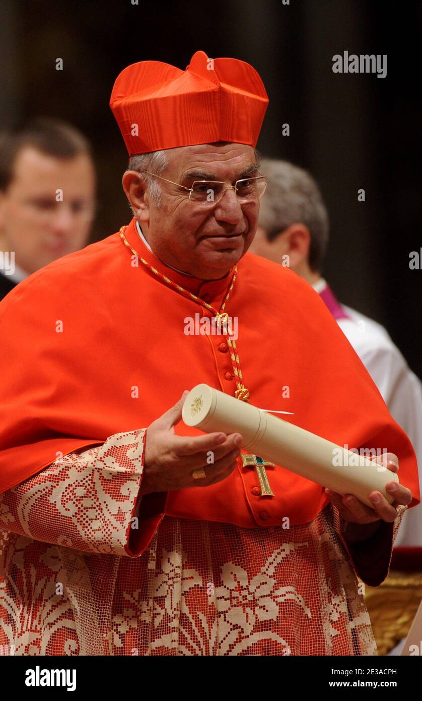 New cardinal Paolo Romeo receives the biretta cap from Pope Benedict ...